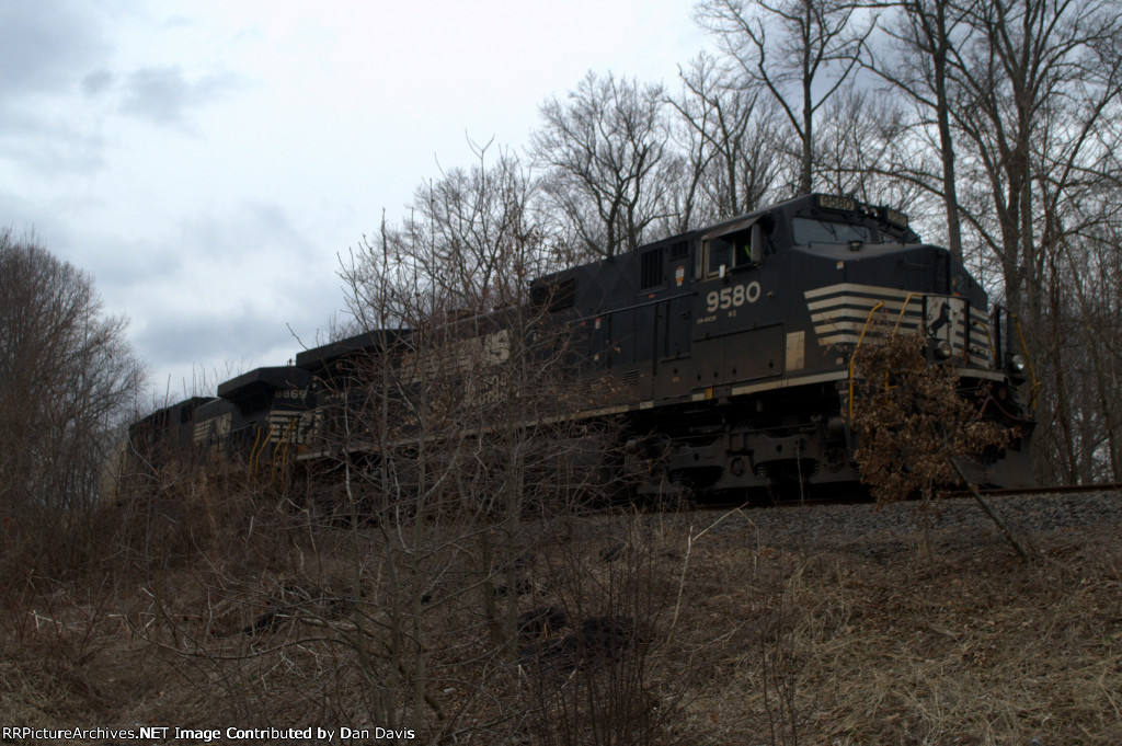 NS C40-9 8869 and NS C44-9W 9580 bring up the rear on B100-23